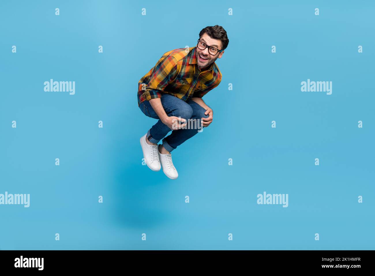 Full body photo of overjoyed glad person jumping falling toothy smile ...