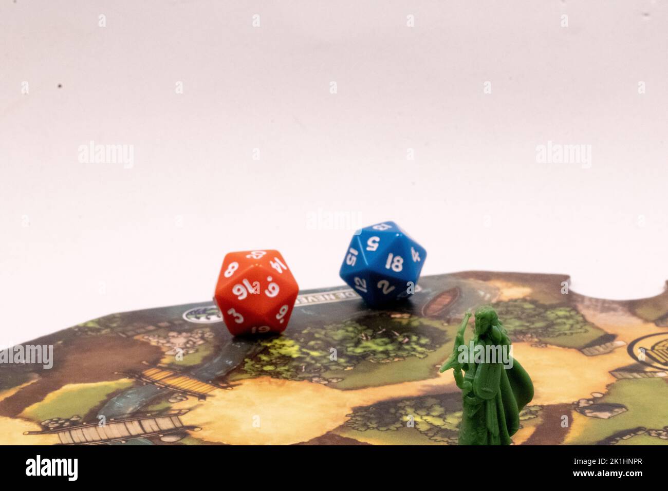 Role play game dices, ground tile and a figure Stock Photo - Alamy