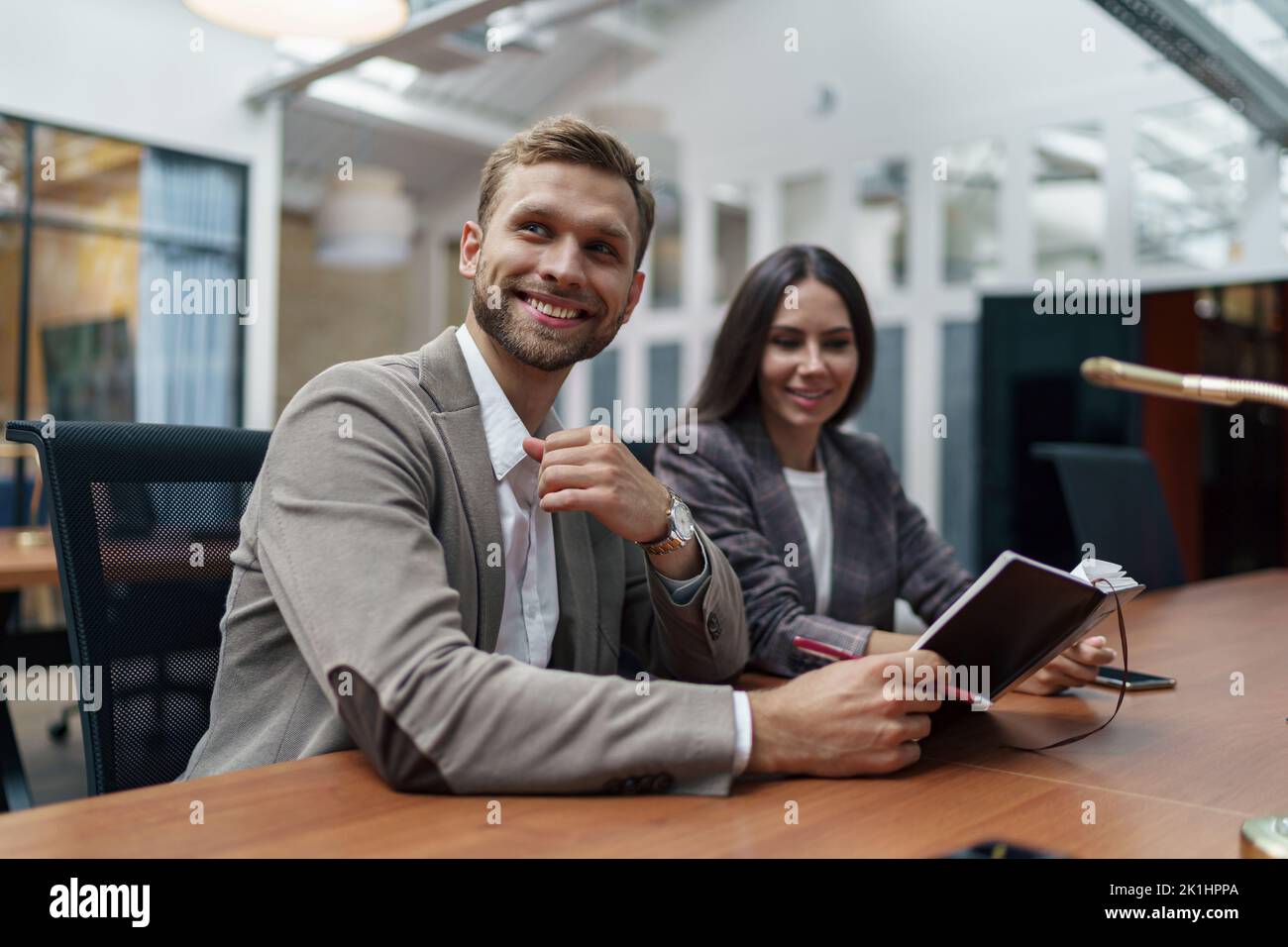 Two businesspartners working together in modern coworking . Teamwork ...