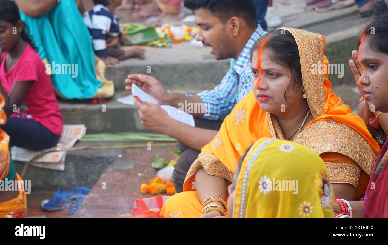 Kolkata, India. 18th Sep, 2022. Women taking a bath at the holy river ...