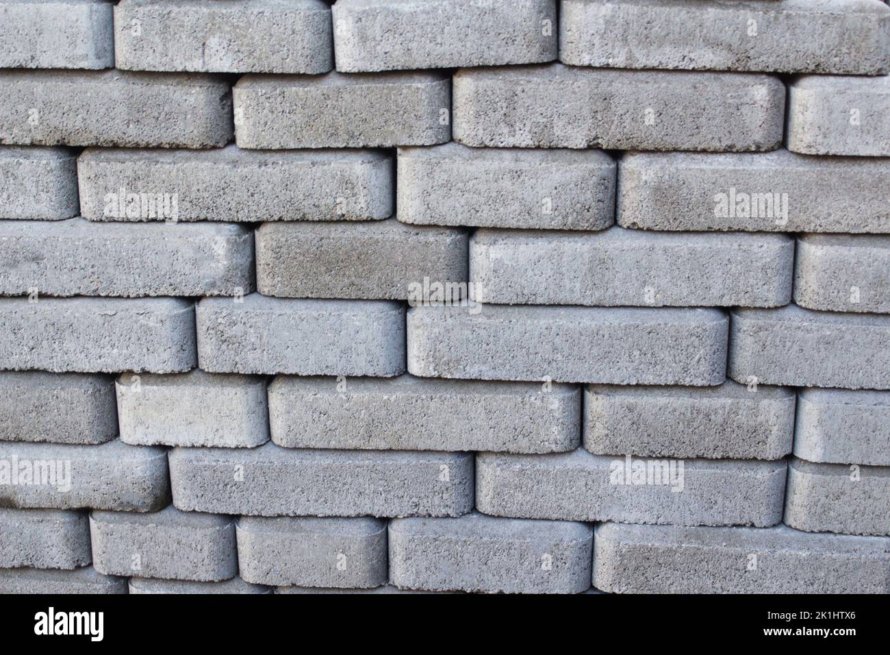 Defocus brick tiles stacked on a pallet. Gray pavement bricks for ...