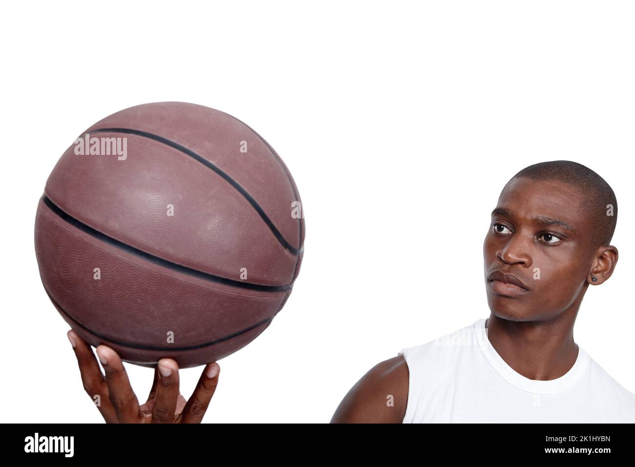 Time to shoot some hoops. Studio shot of a young basketball player ...