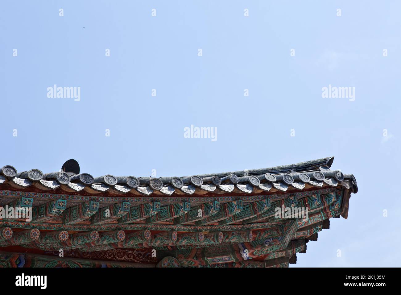 The old roof of the eaves that stretched straight toward the sky is ...