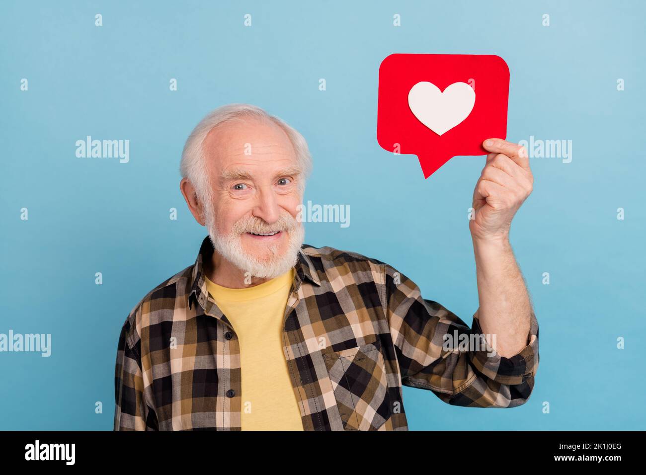 Photo of dreamy pretty man pensioner dressed checkered shirt holding ...