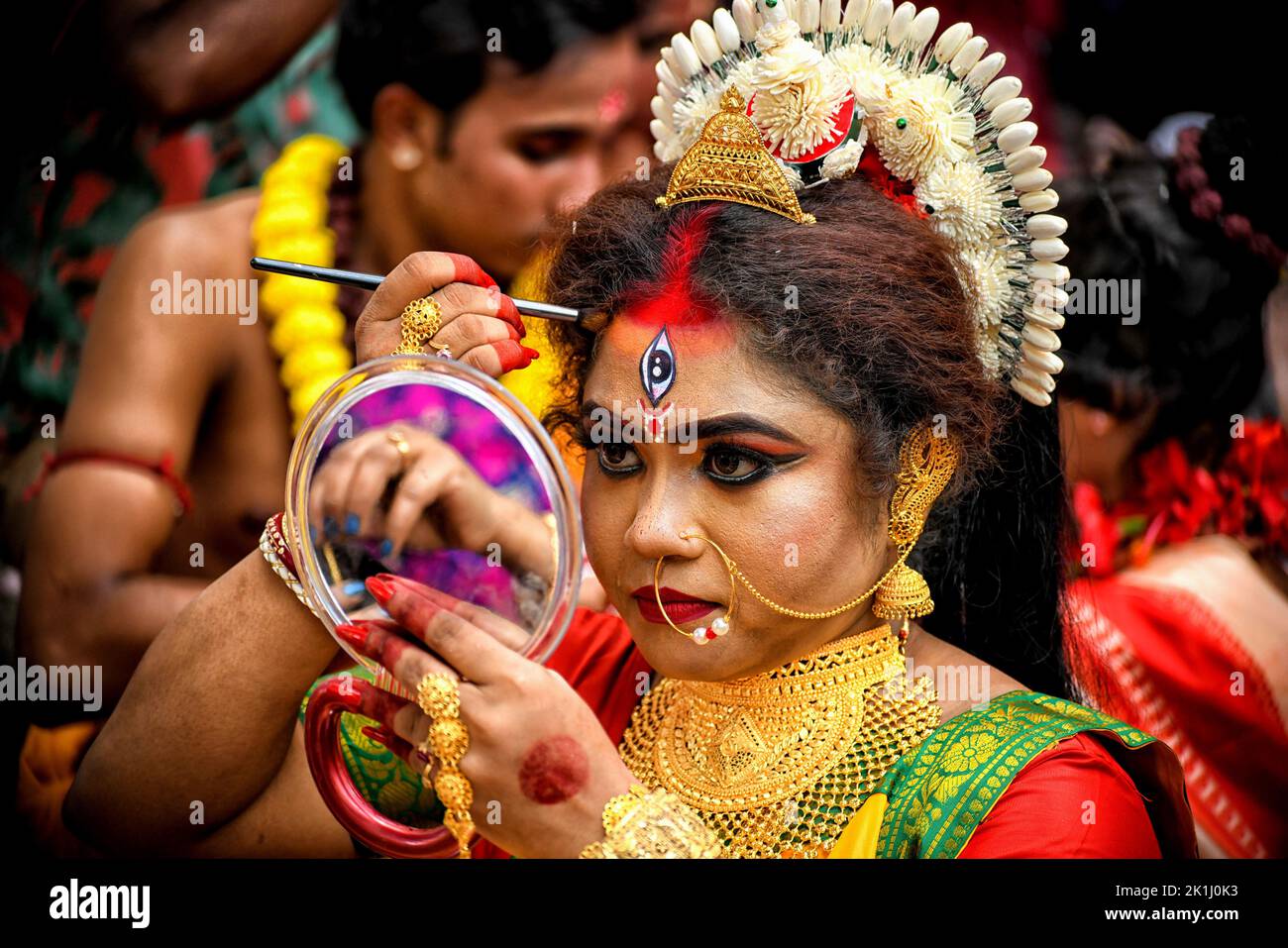 Kolkata, India. 18th Sep, 2022. Models dressed as Hindu deity Durga put ...