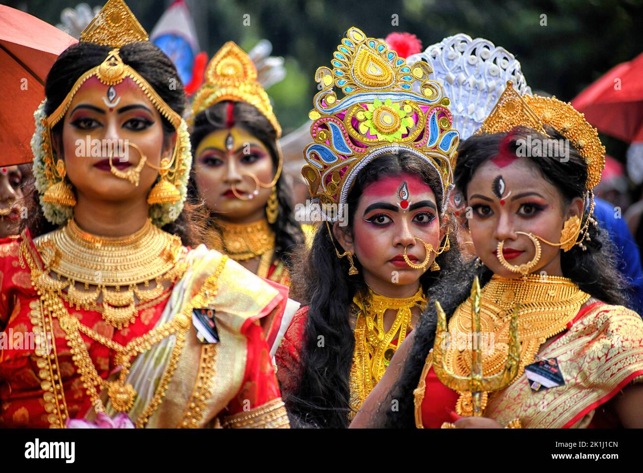 Models dressed as Hindu deity Durga take part in a live makeup event ...