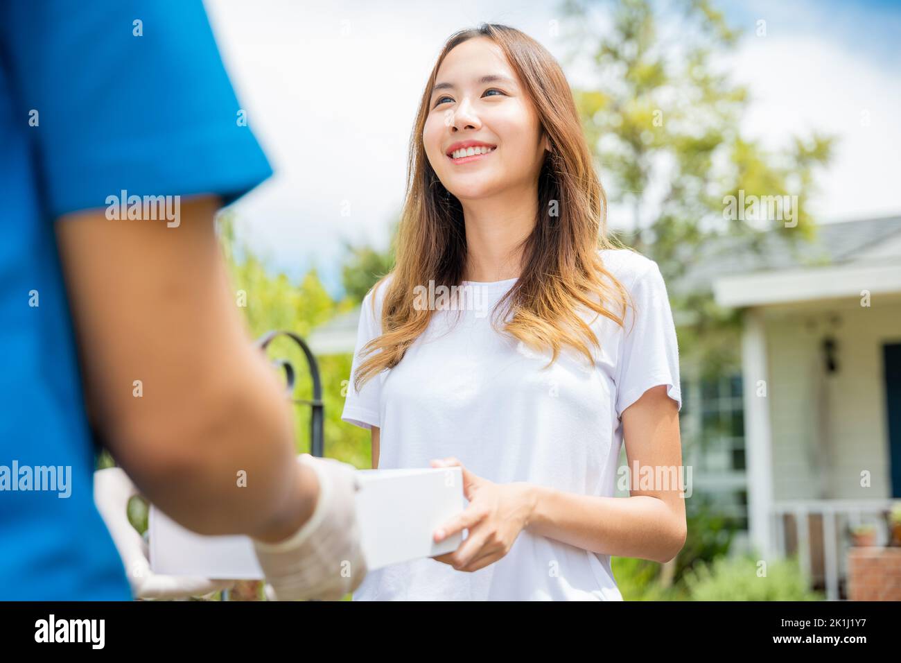 Sick Asian young woman receive medicine first aid pharmacy box from ...