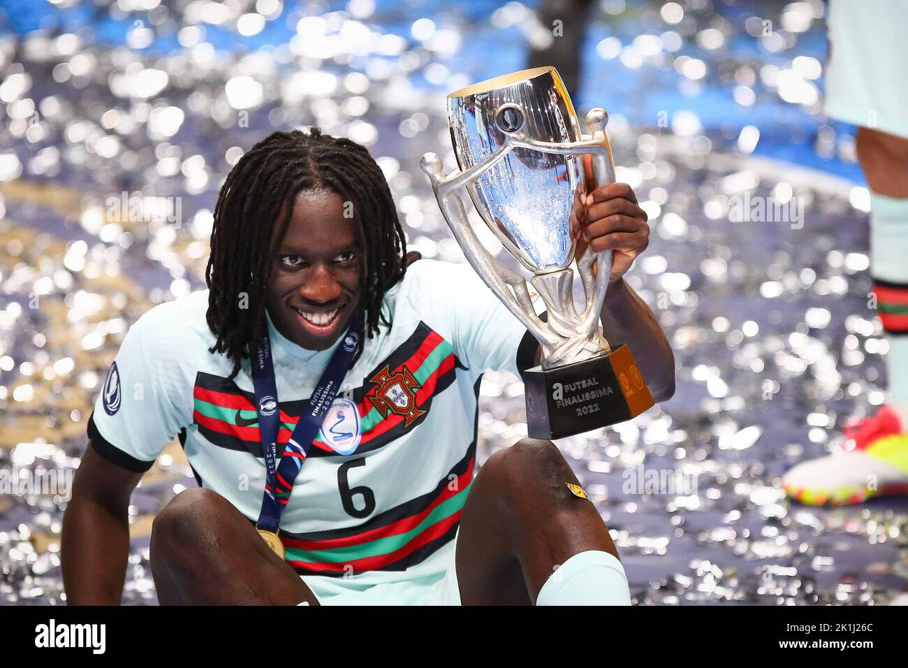 Zicky Te of Portugal holds a trophy during the final match between ...