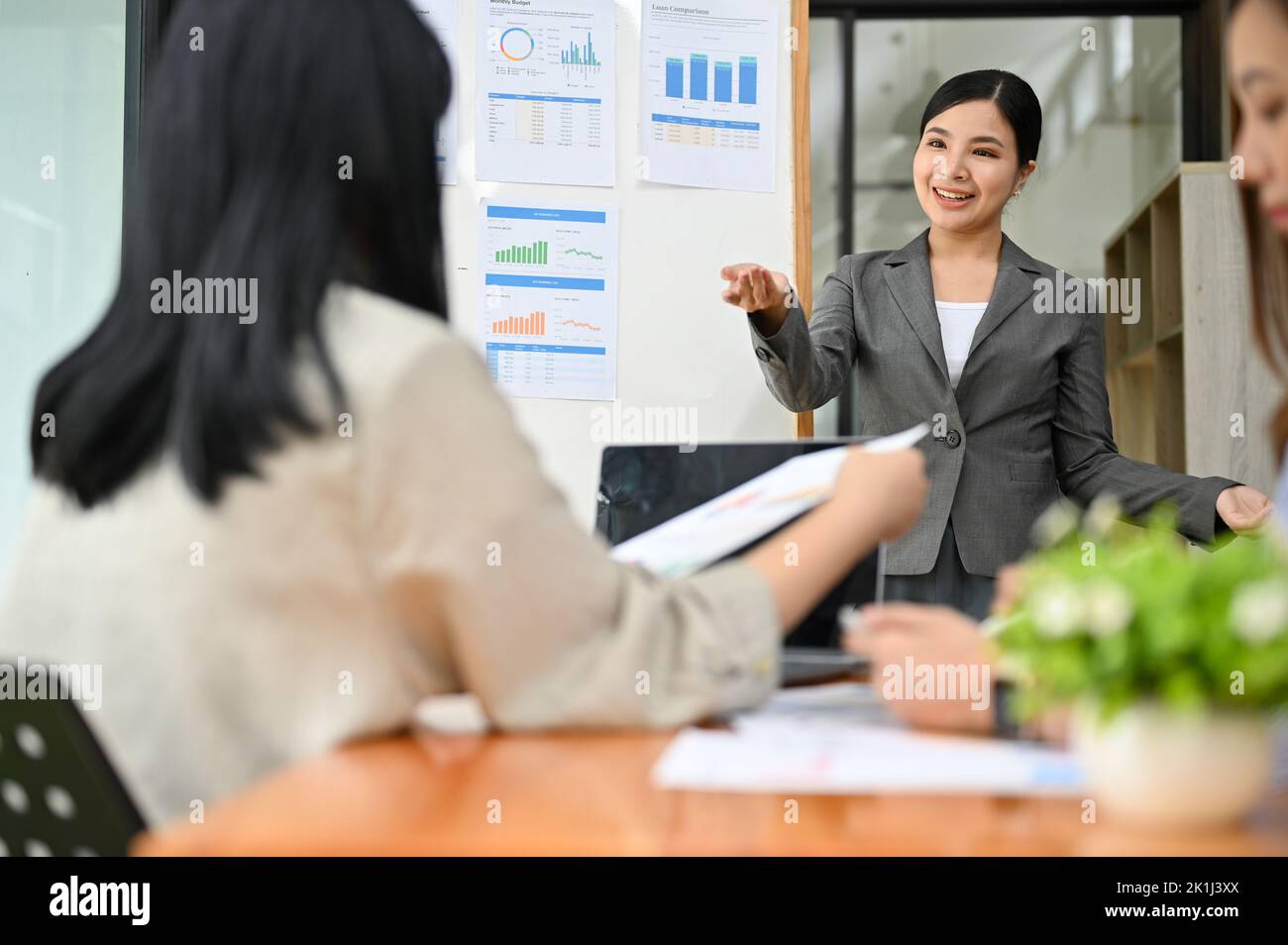 Professional millennial Asian female boss or CEO training, coaching and ...