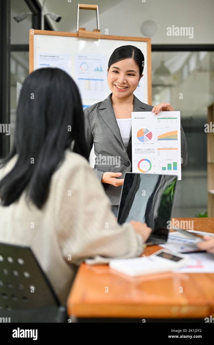 Portrait, Successful and professional millennial Asian female boss or ...