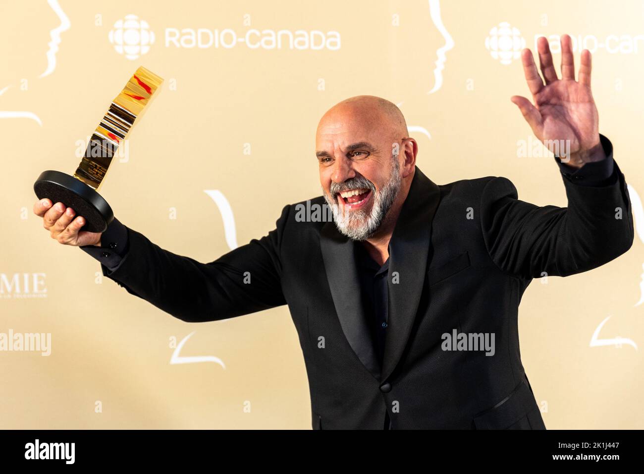 Sylvain Marcel holds up his award for supporting actor in a drama ...