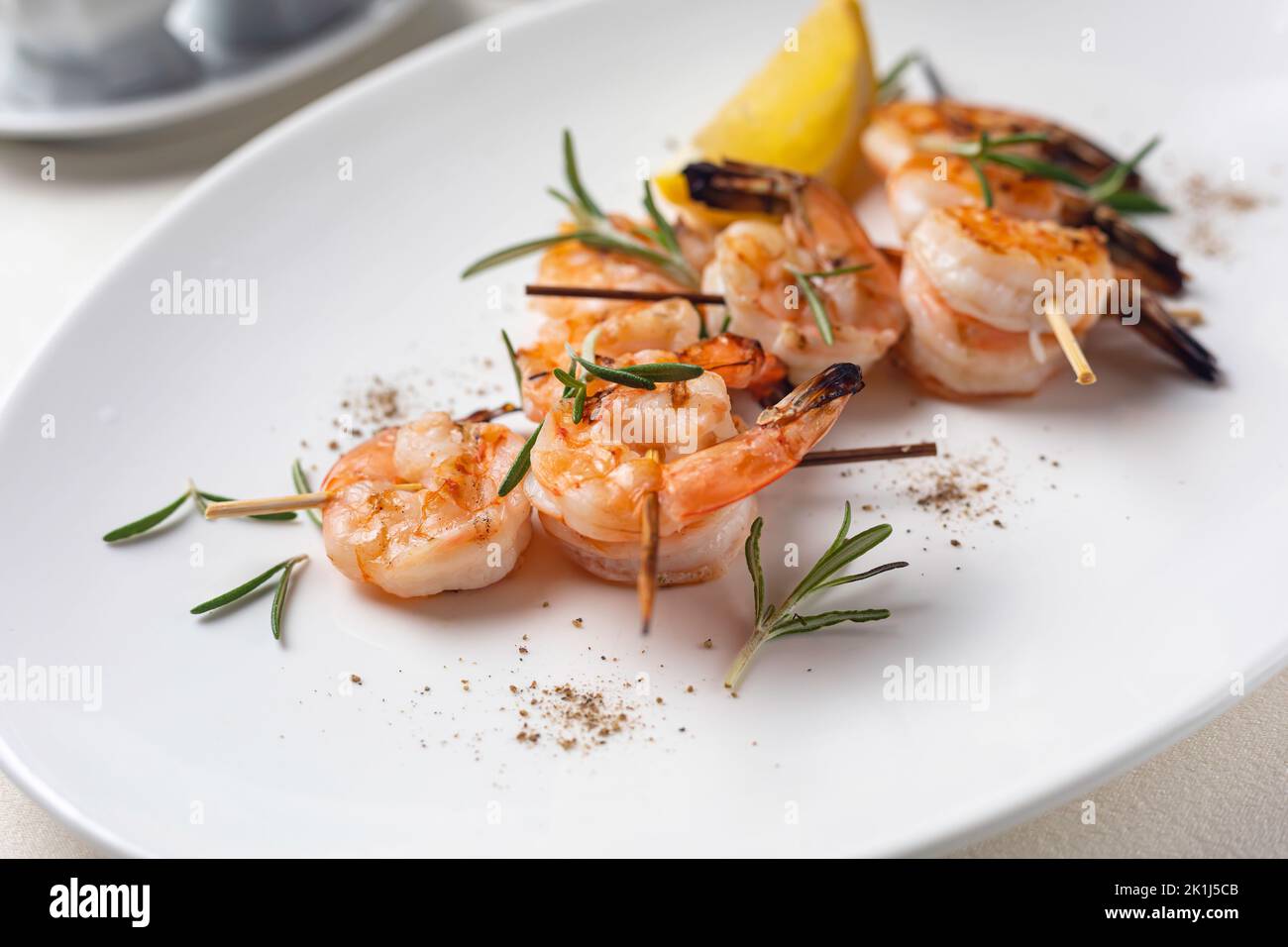 A plate of tasty grilled shrimps with herbs, closeup shot Stock Photo ...