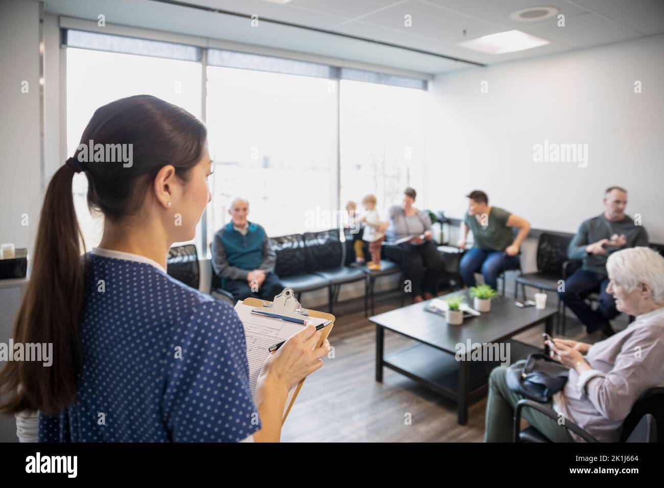 Doctor calling patient hi-res stock photography and images - Alamy