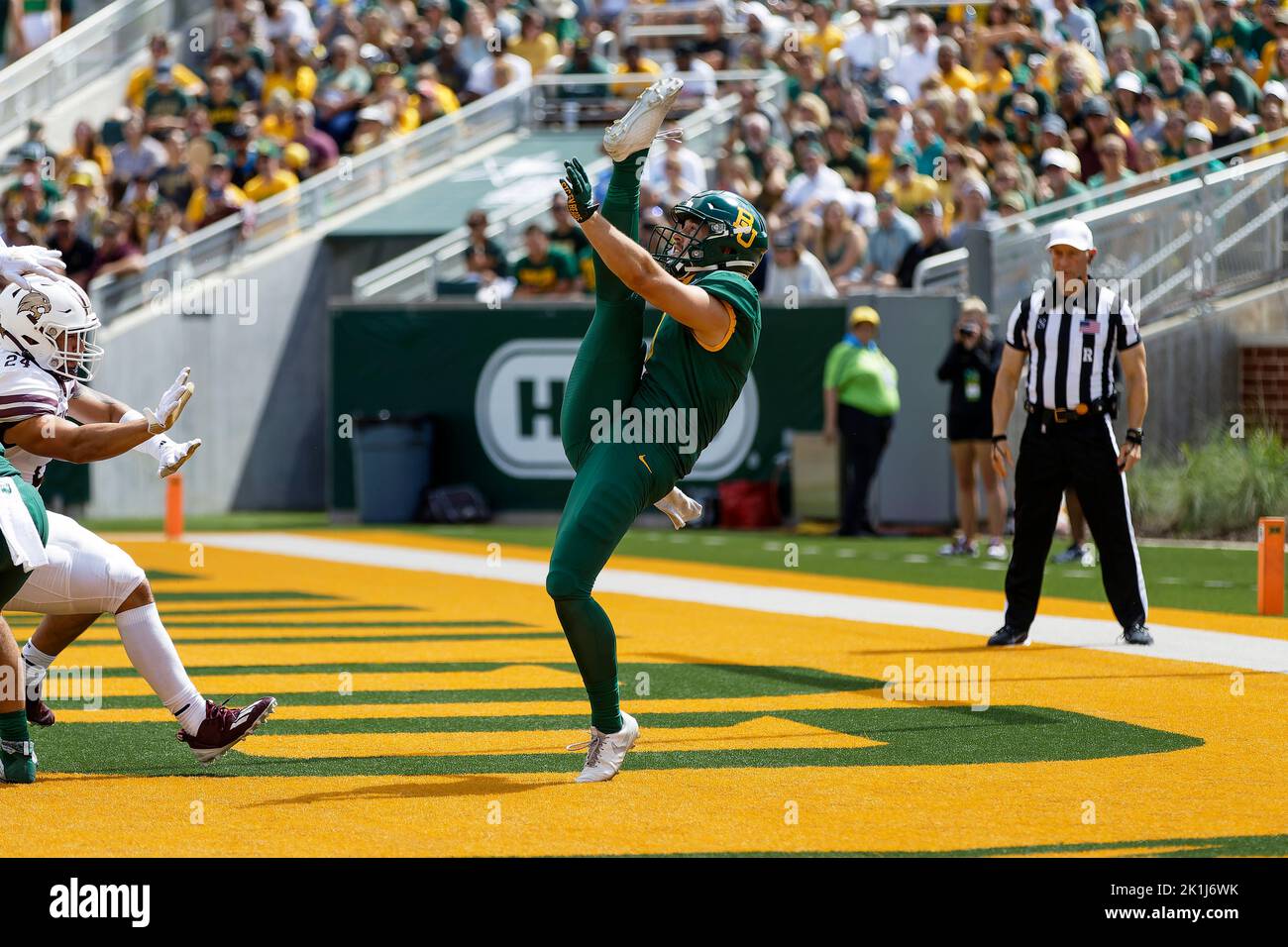 Baylor Bears punter Issac Power (1) punts from the back of his end zone ...