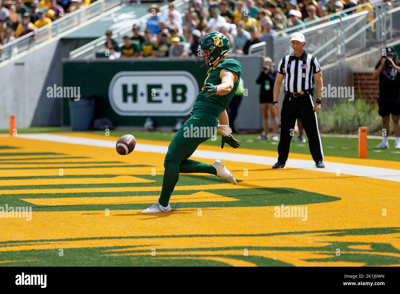 Baylor Bears punter Issac Power (1) punts from the back of his end zone ...