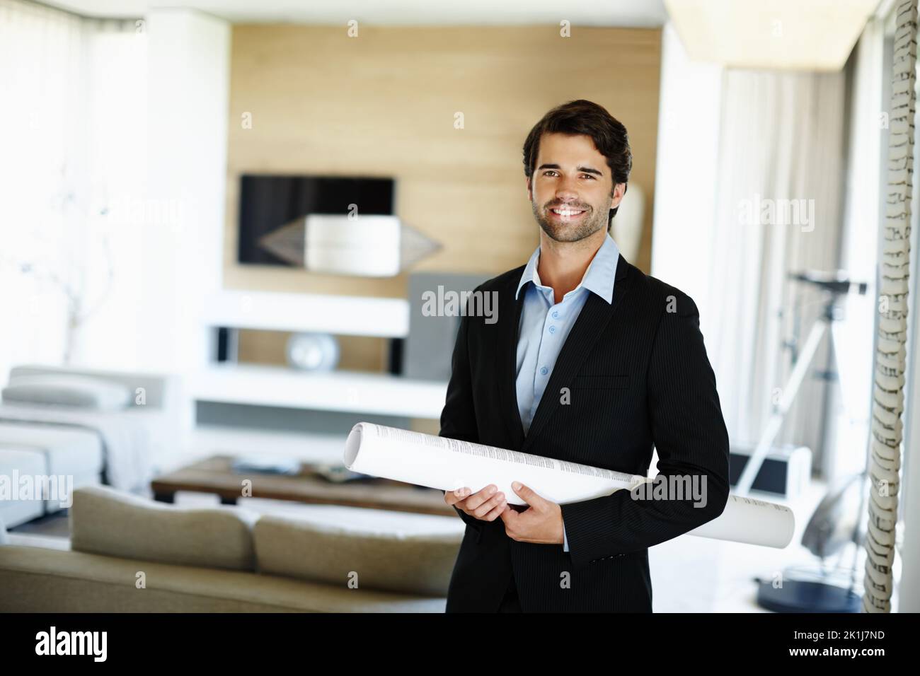 Hes passionate about his plans. A handsome young architect wearing a ...