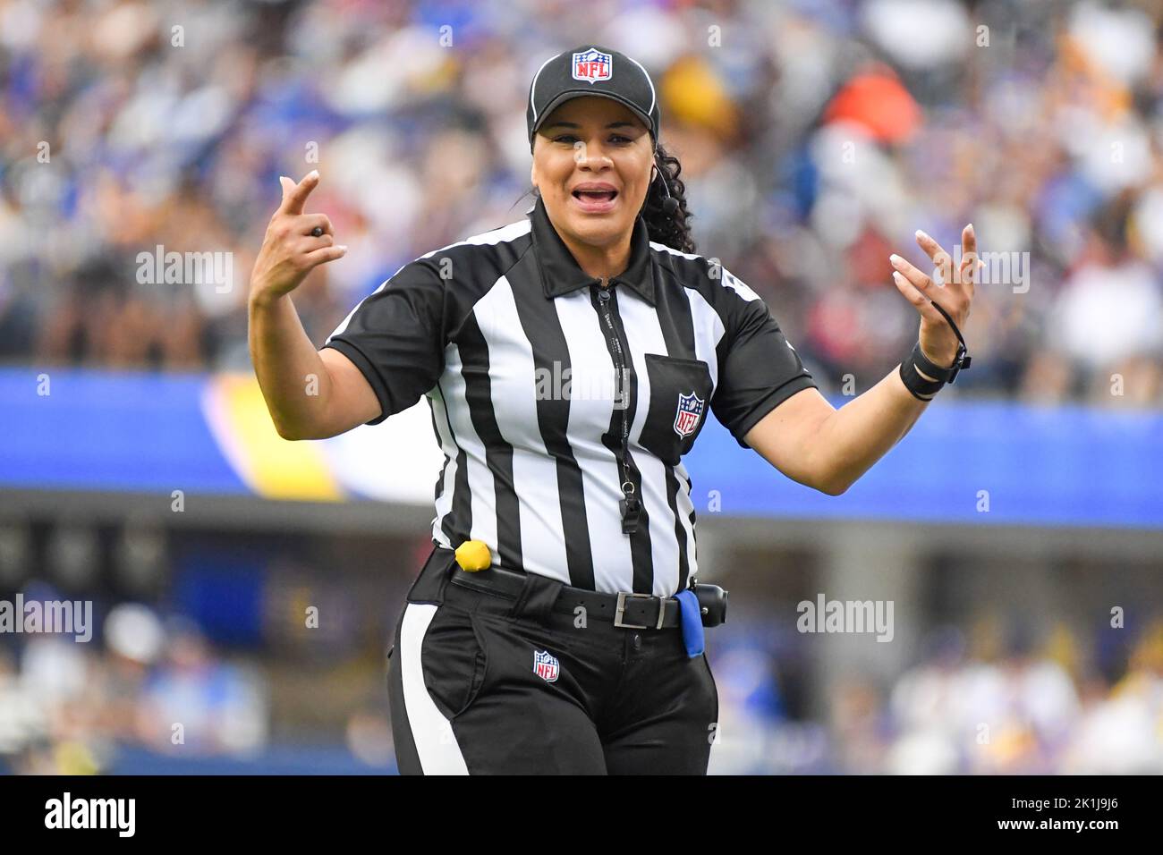 NFL Line Judge Maia Chaka (100) walks on the field during an NFL game ...