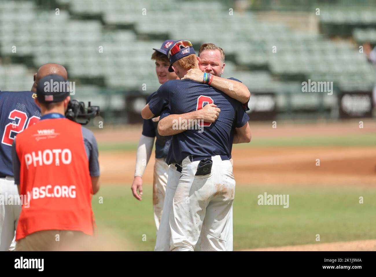 Sarasota, FL. USA; Team USA head coach Denny Hocking hugs shortstop ...