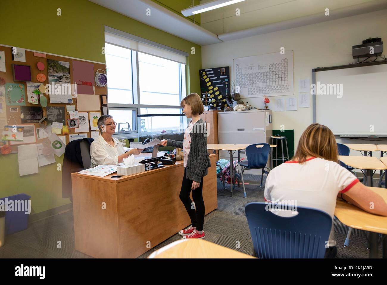 Teacher and child classroom desk hi-res stock photography and images ...