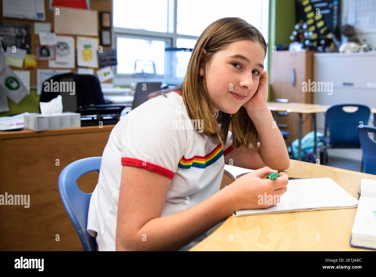 Smiling junior high girl student in classroom hi-res stock photography ...
