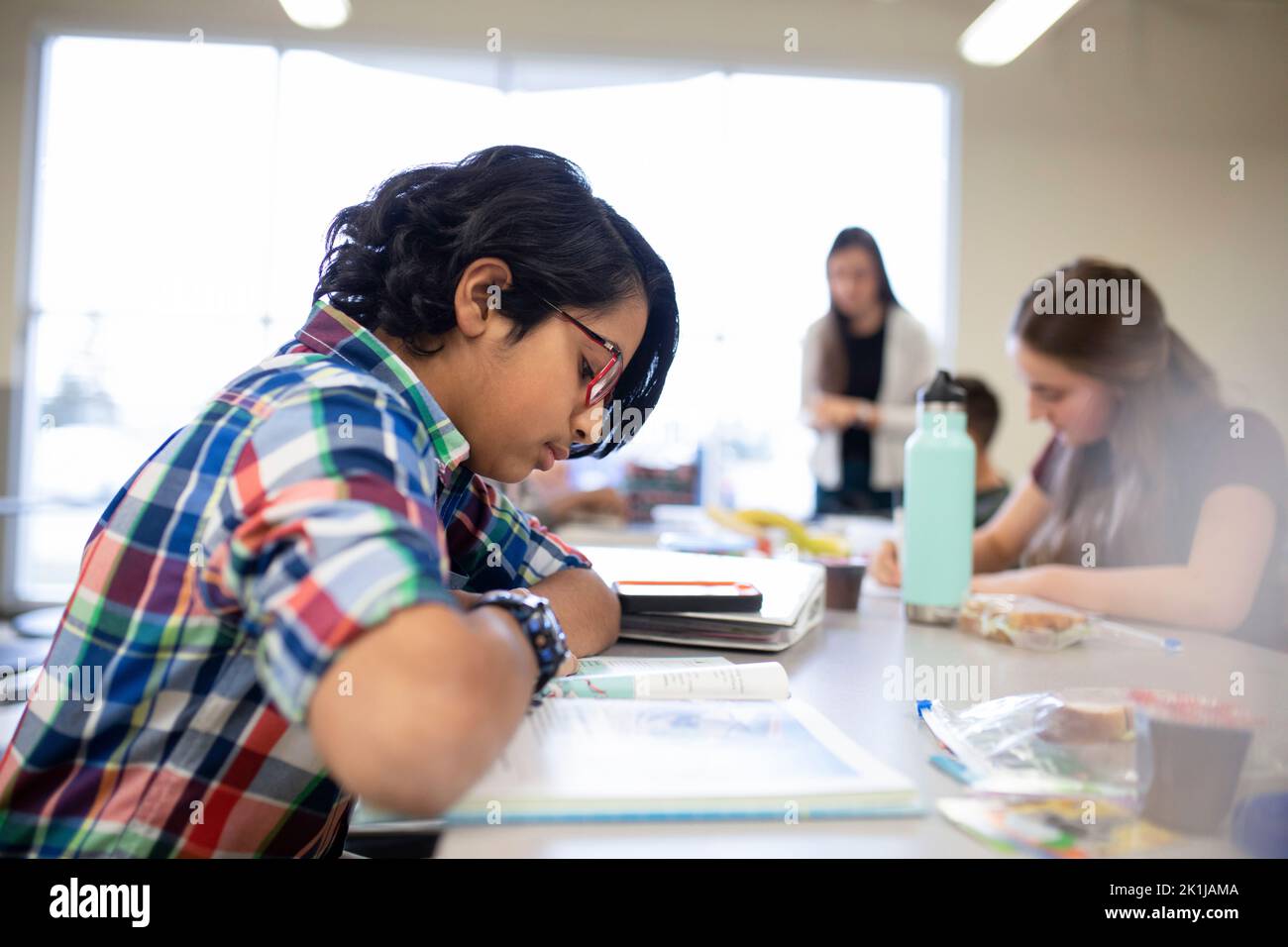 Boy sitting school desk leaning hi-res stock photography and images - Alamy