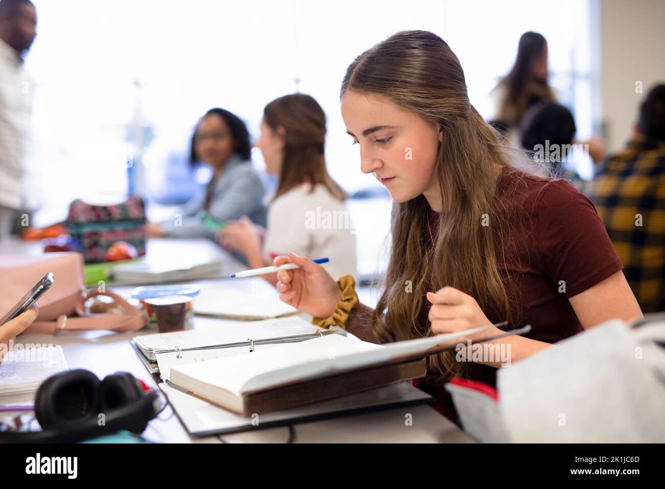 Junior high school girl reading book hi-res stock photography and ...