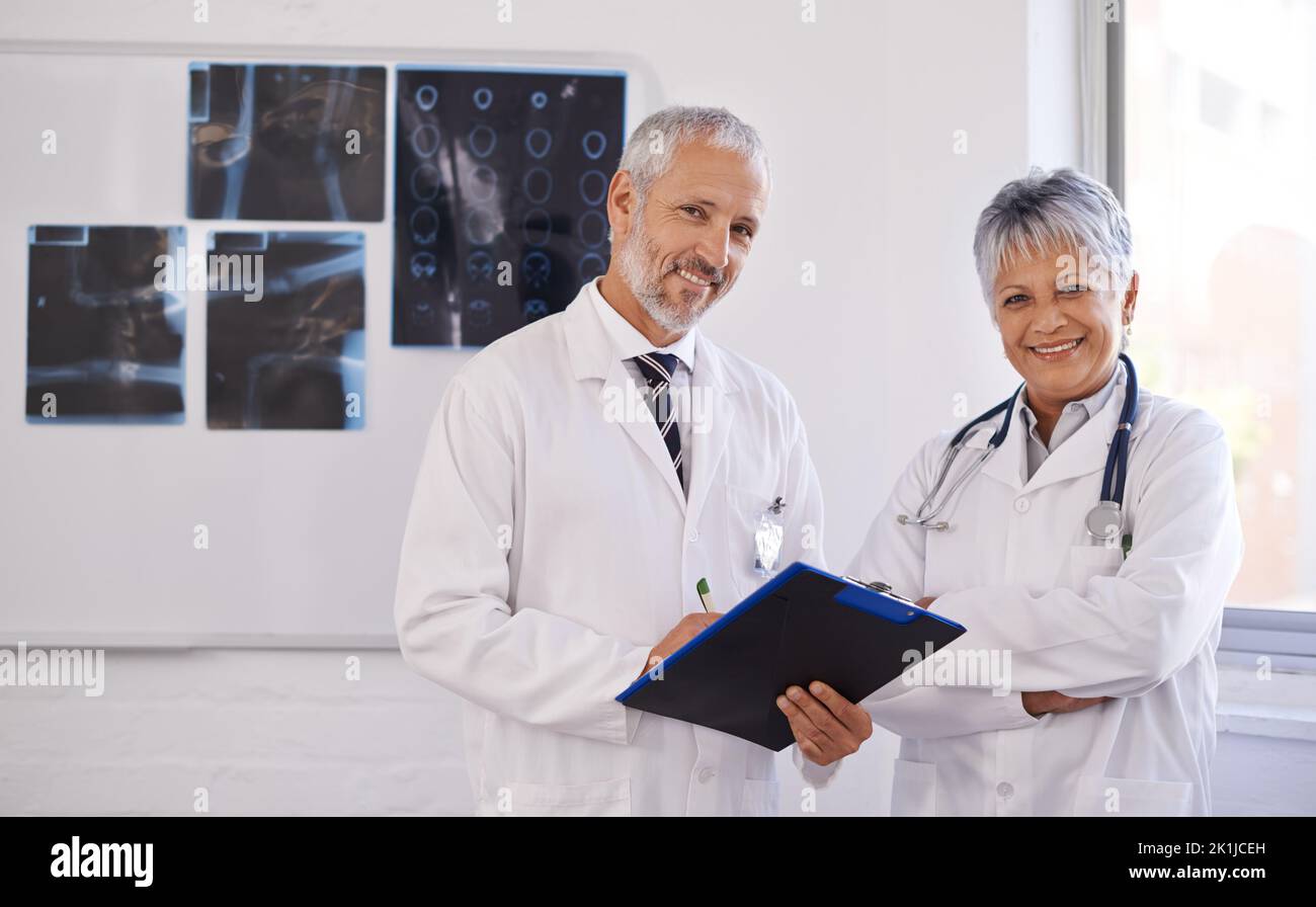 Consulting a colleague for a second opinion. two doctors working ...