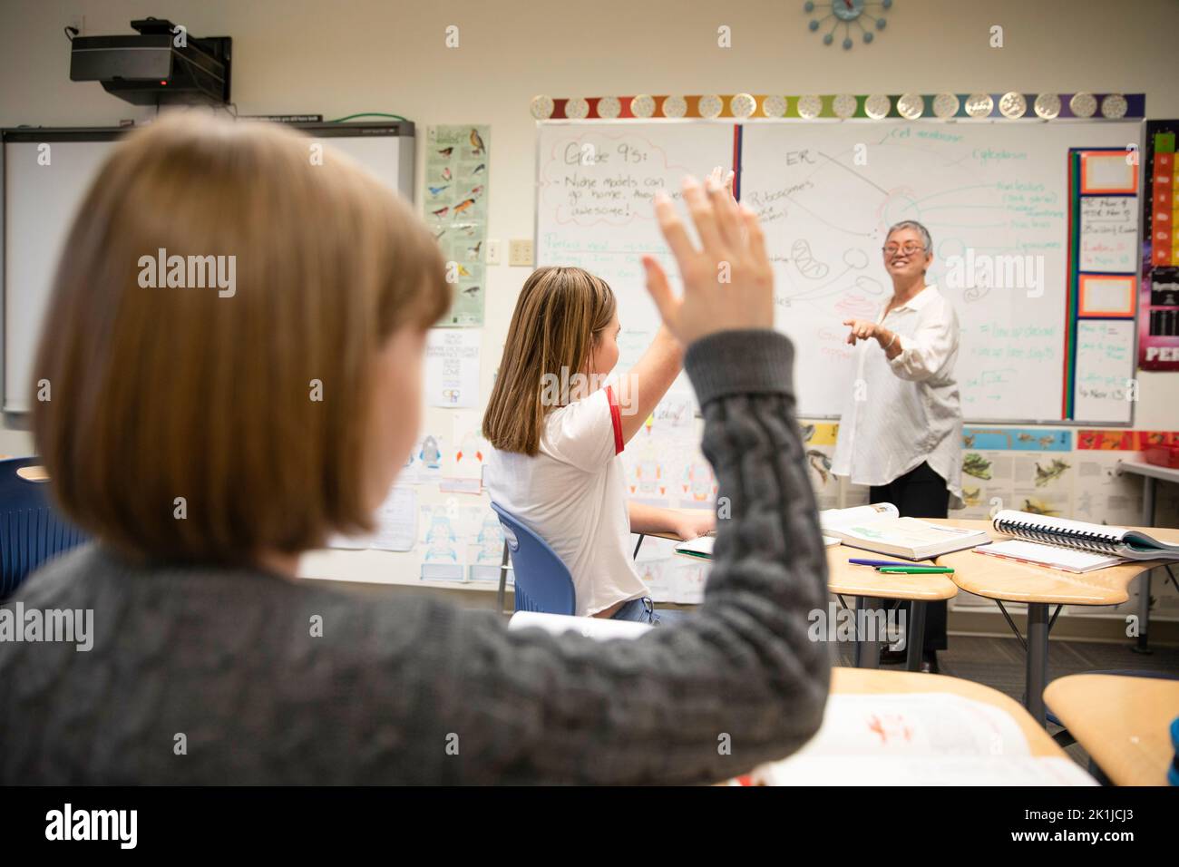 Raised hands classroom hi-res stock photography and images - Alamy