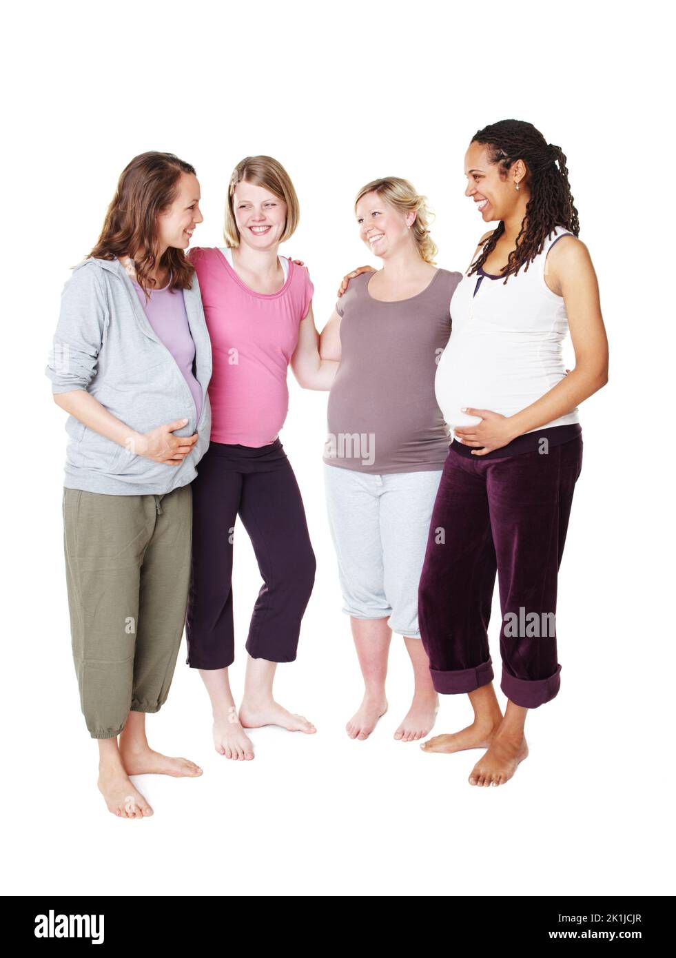 Sharing their pregnancy experiences. Pregnant friends standing together ...