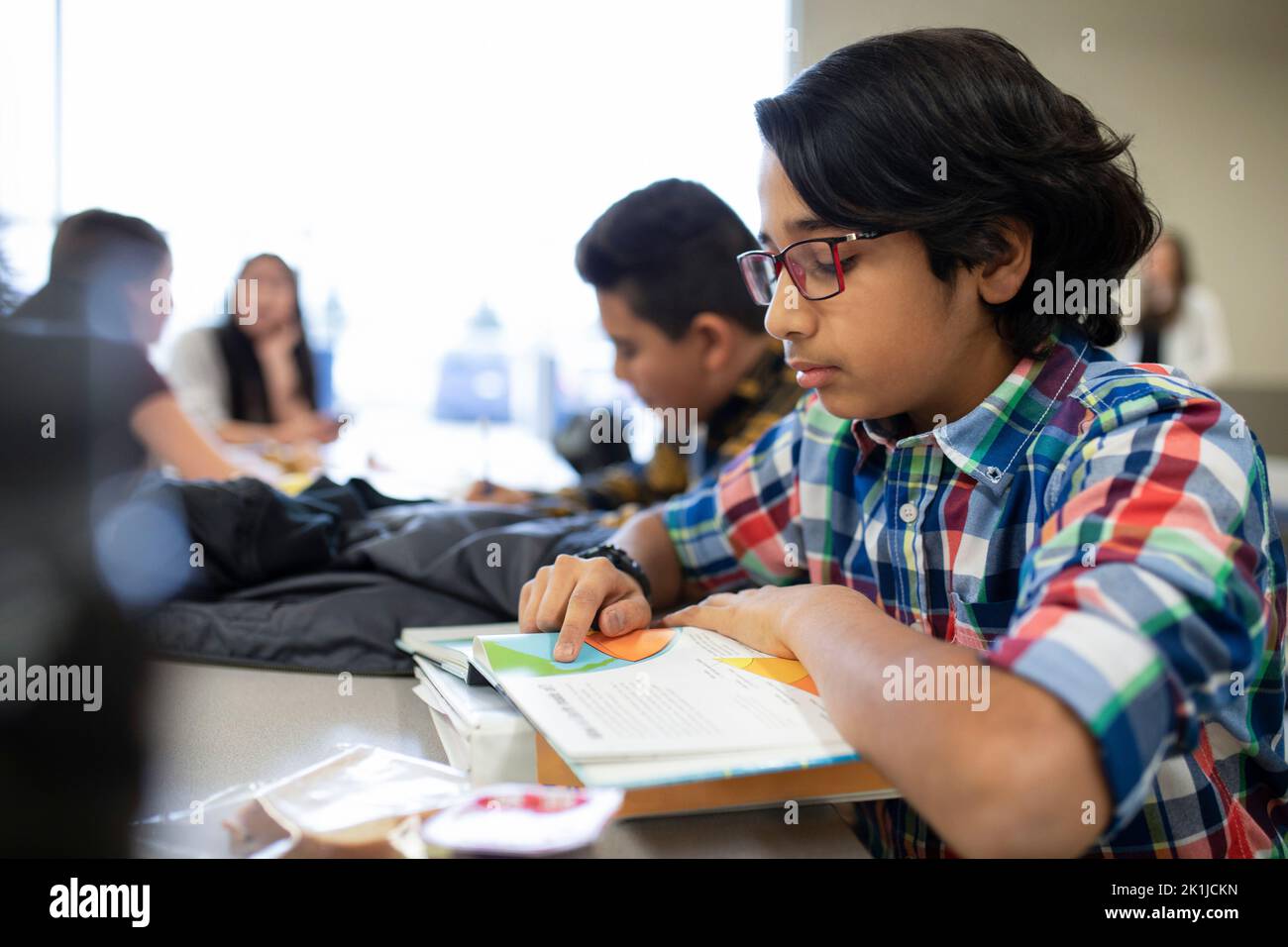 Boy reading at desk hi-res stock photography and images - Alamy