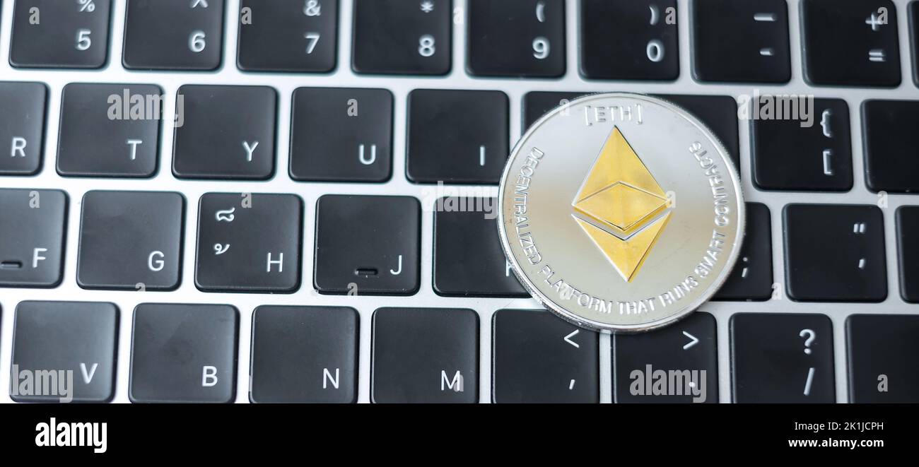 silver Cryptocurrency on keyboard laptop, Ethereum coin. Crypto is ...