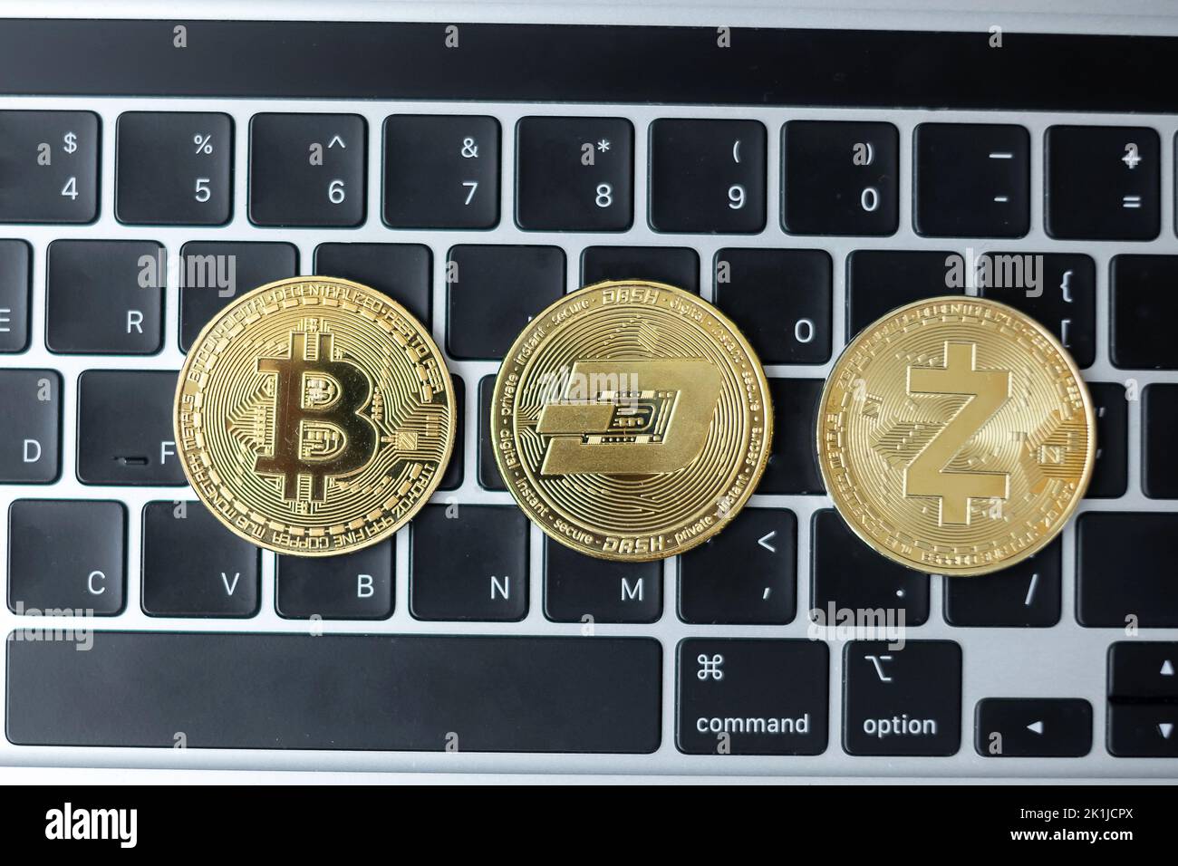 golden Cryptocurrency on keyboard laptop, Bitcoin, Dash, Zcach coins ...