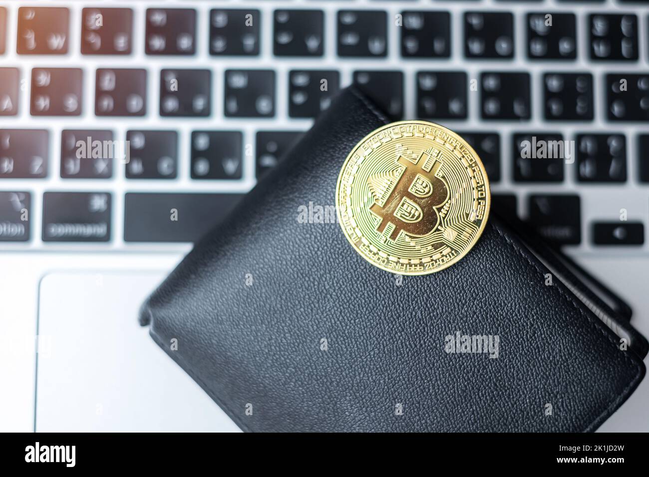 golden Cryptocurrency and wallet on keyboard laptop, Bitcoin coin ...