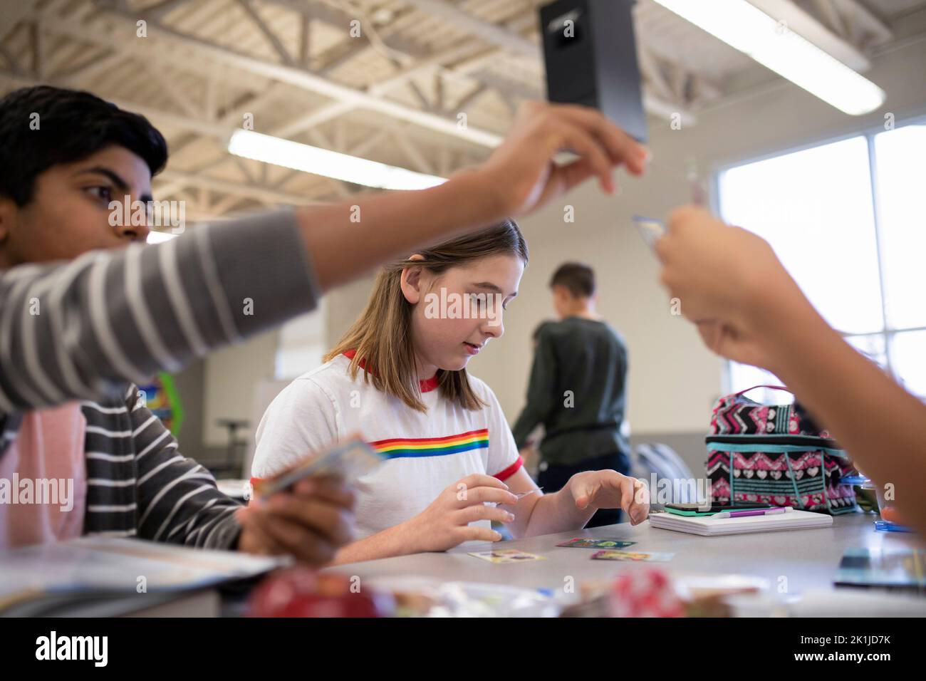 Childhood holding sitting looking down education classroom hi-res stock ...