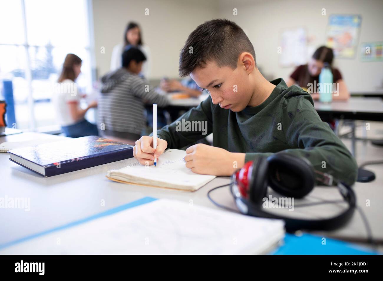 High school boy writing in notebook hi-res stock photography and images ...