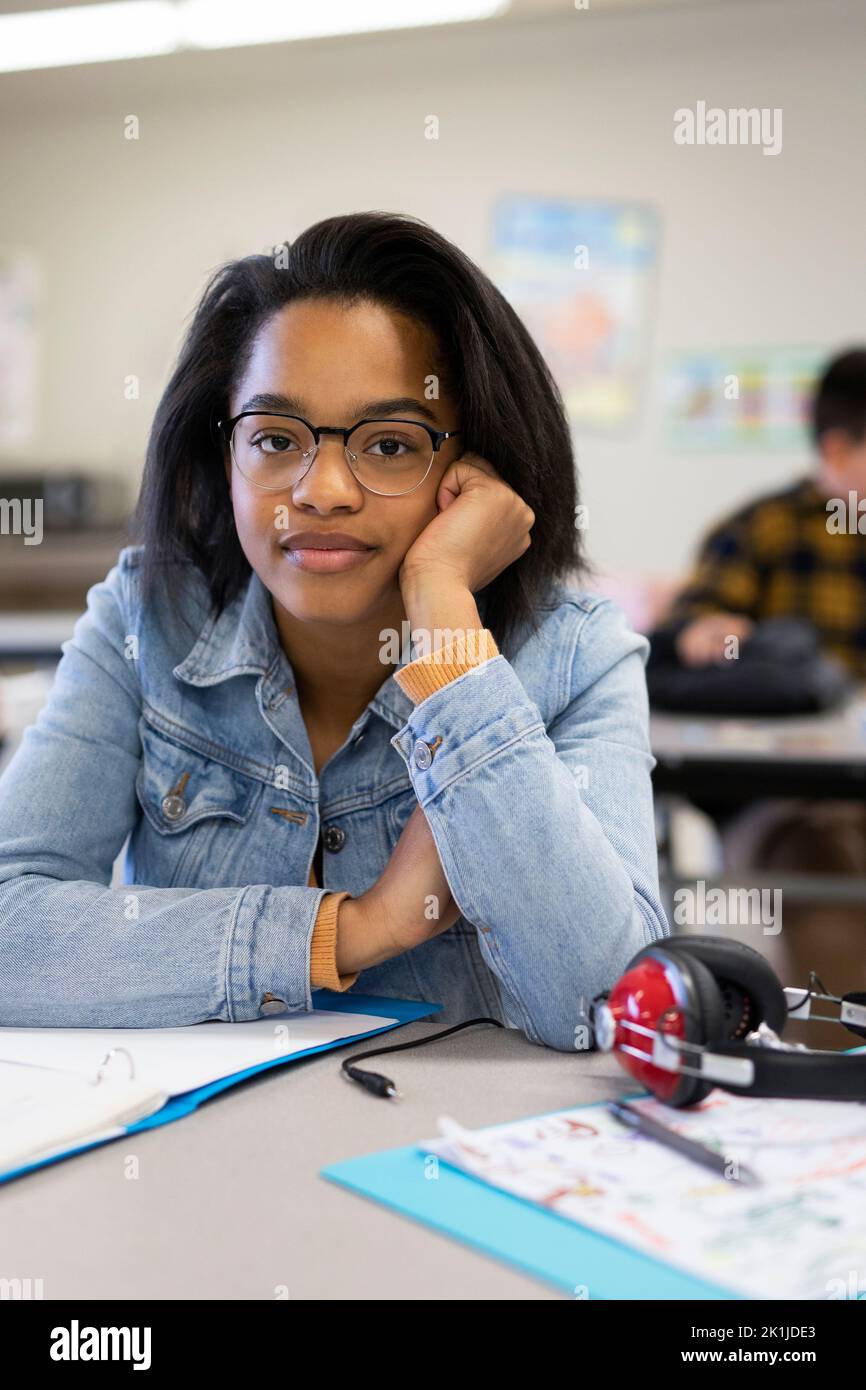 African school girl posing at a desk hi-res stock photography and images - Alamy