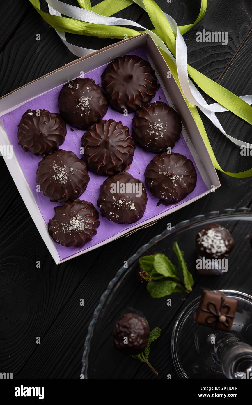A vertical top view of chocolate zephyrs in a carton box Stock Photo ...