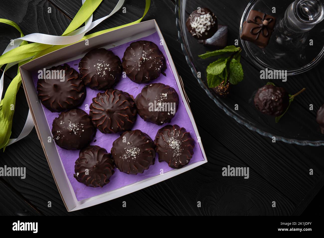 A top view of chocolate zephyrs in a carton box Stock Photo - Alamy