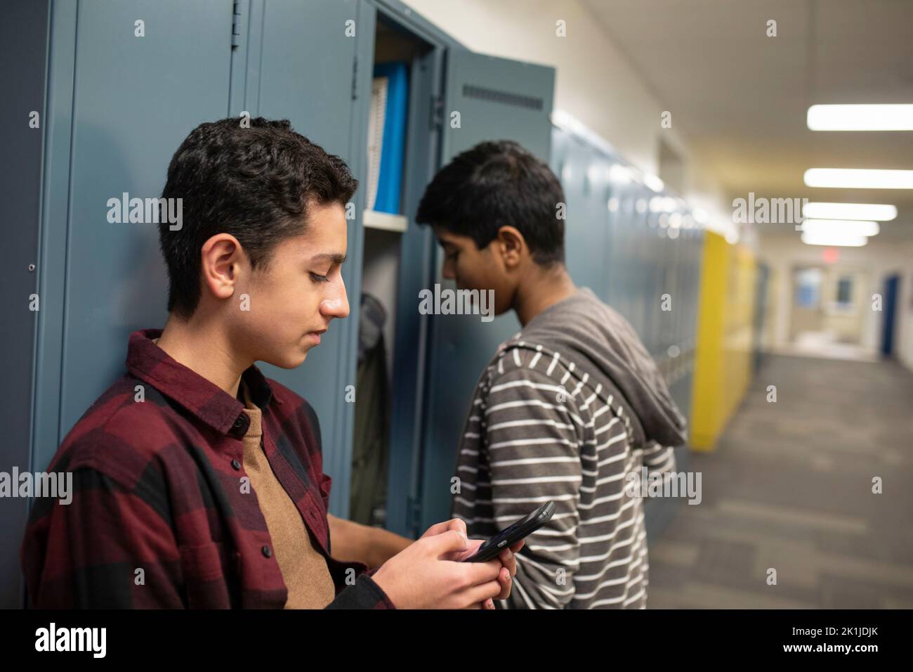 Junior high boy student using smart phone hi-res stock photography and ...