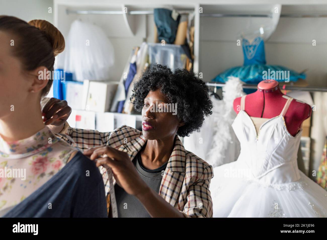 Female fashion designer measuring model hi-res stock photography and ...