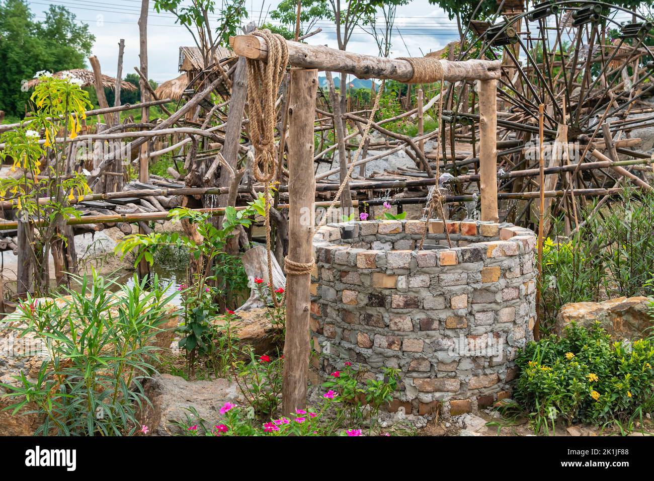 Beautiful artesian well made by bricks with cement and wheel pulley ...