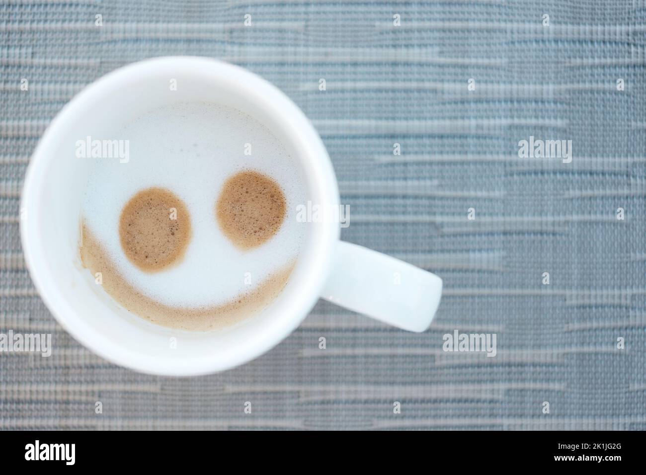 Smile face shape of hot cappuccino coffee. Have a nice day concept ...