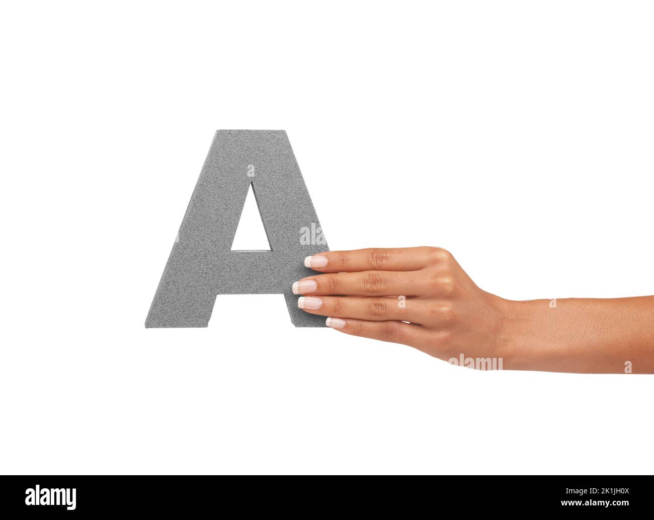 Showing you the letter A. A young woman holding a capital letter A ...