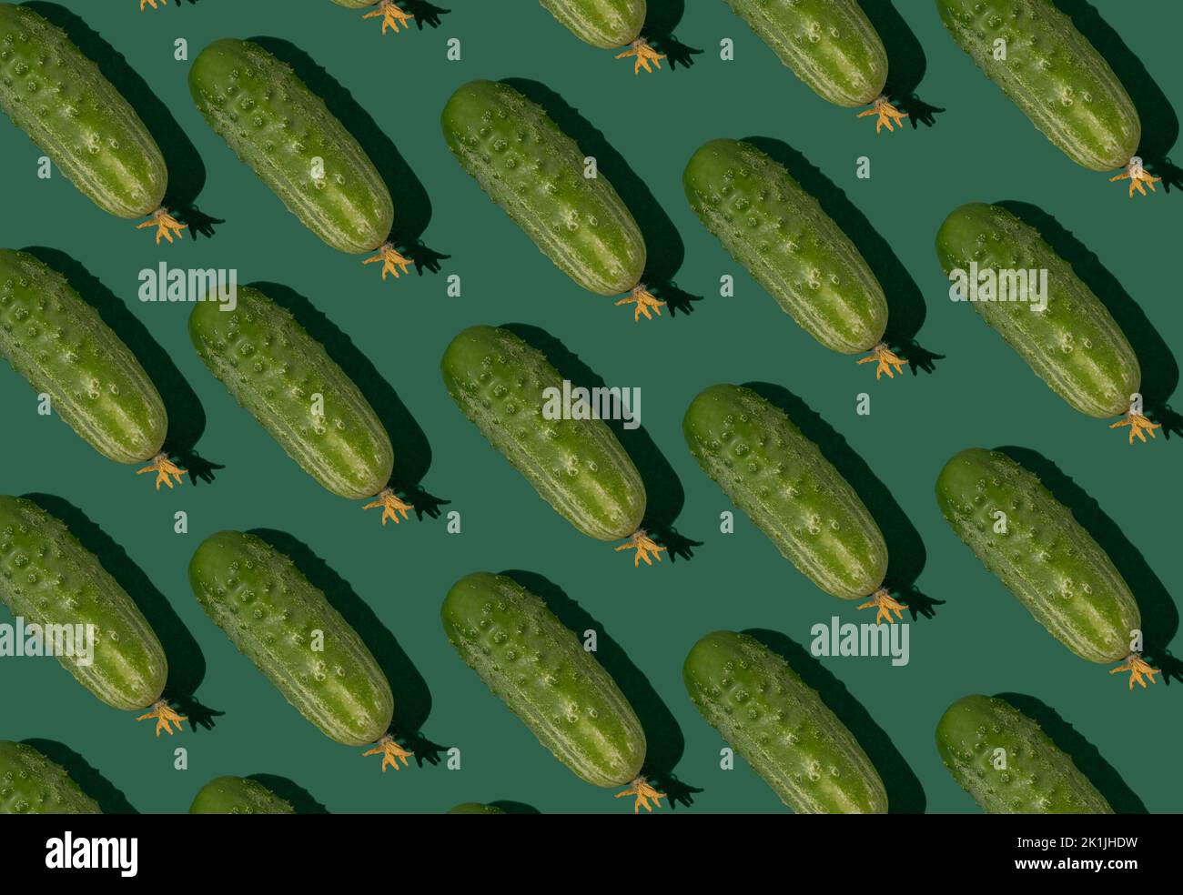 Cucumber pattern. Cucumbers on a green background. Vegetables food ...