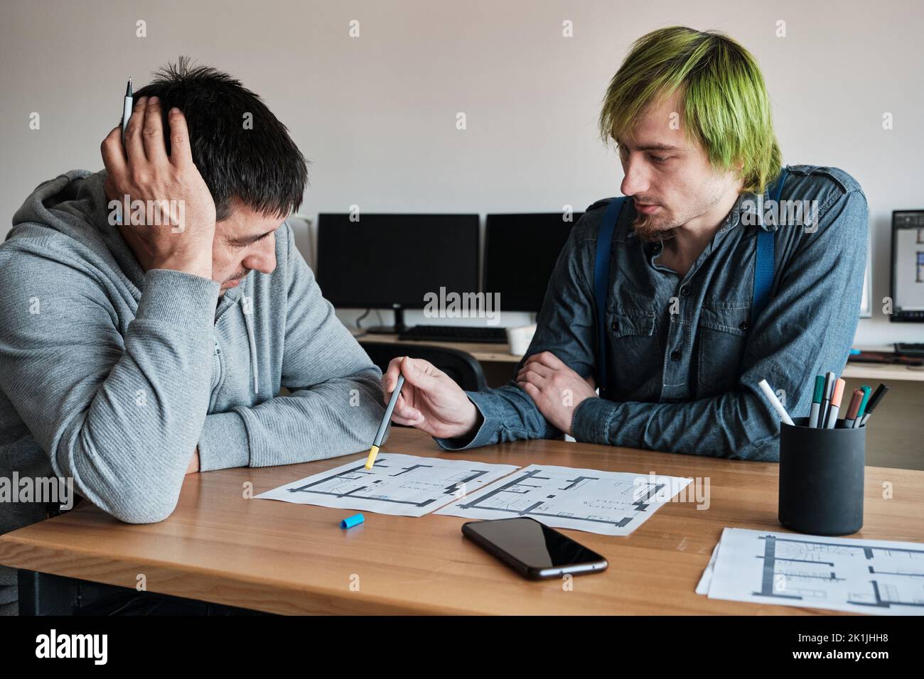 Team of two colleagues interior designers working on architectural ...