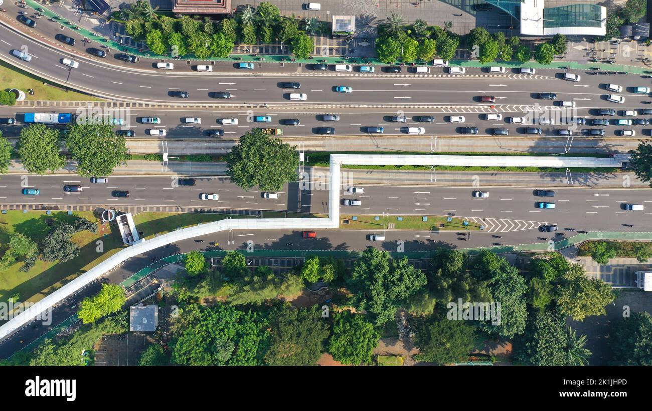 Aerial view of pedestrian bridge that is in the corner of the city of ...