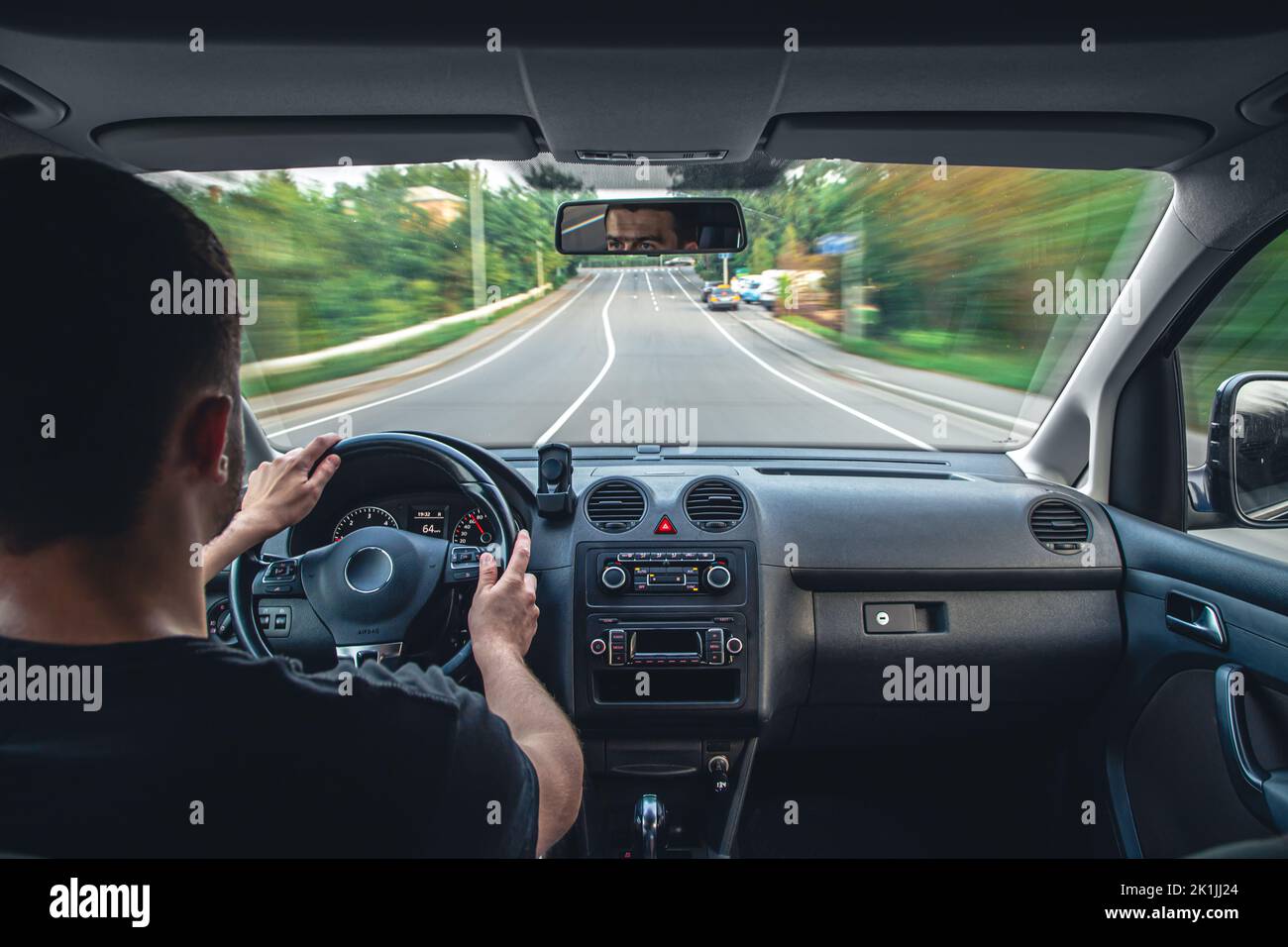 Hands on the wheel when driving at high speed from inside the car Stock ...