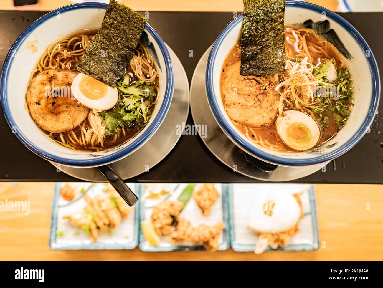 Two plates of ramen on a metal tray Stock Photo - Alamy