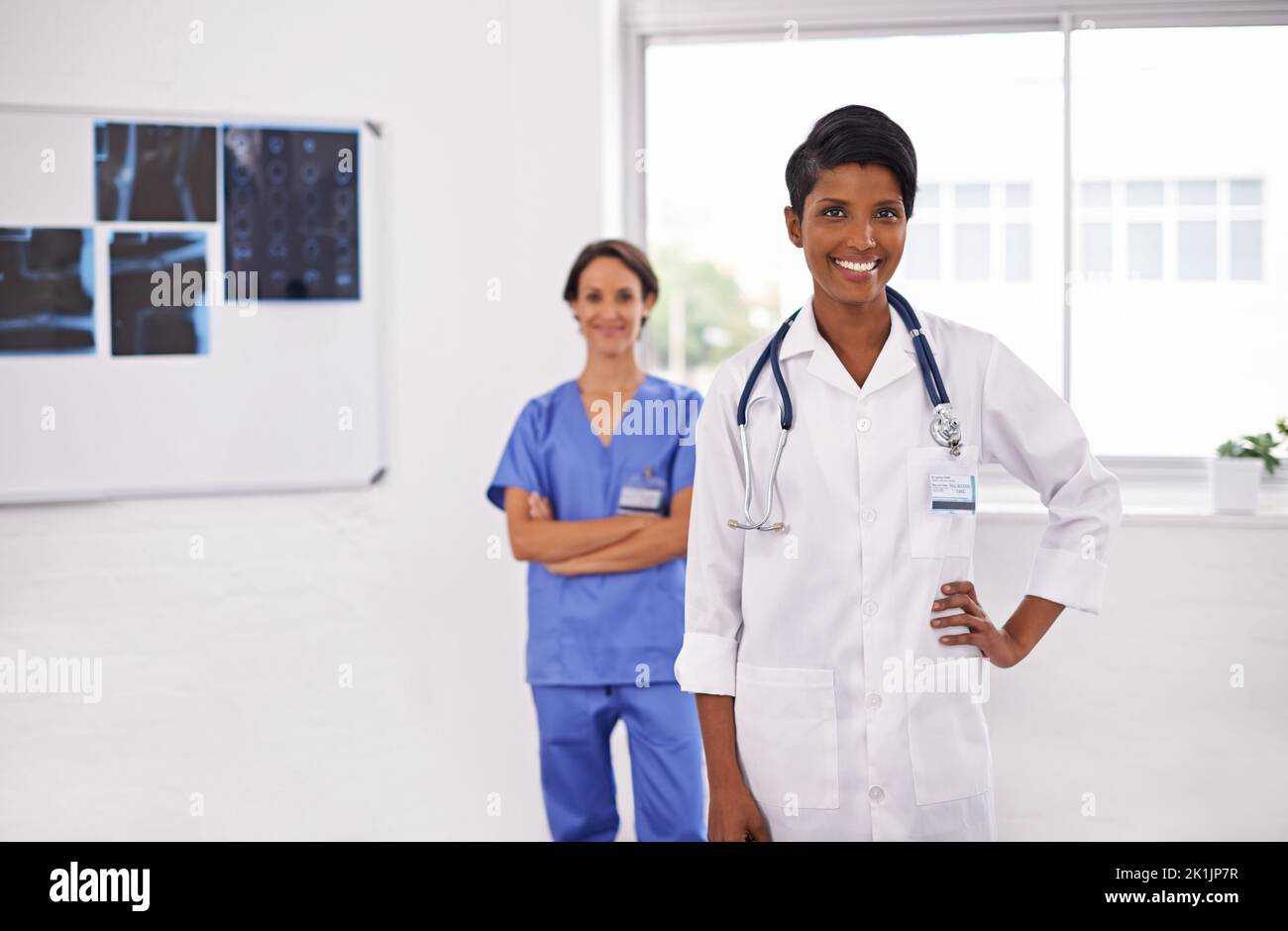 Theyll fix any break. two attractive young female doctors Stock Photo ...