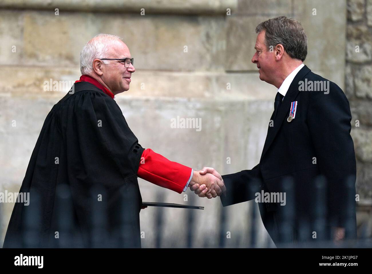 The Dean of Westminster David Hoyle shakes hands with Scottish ...